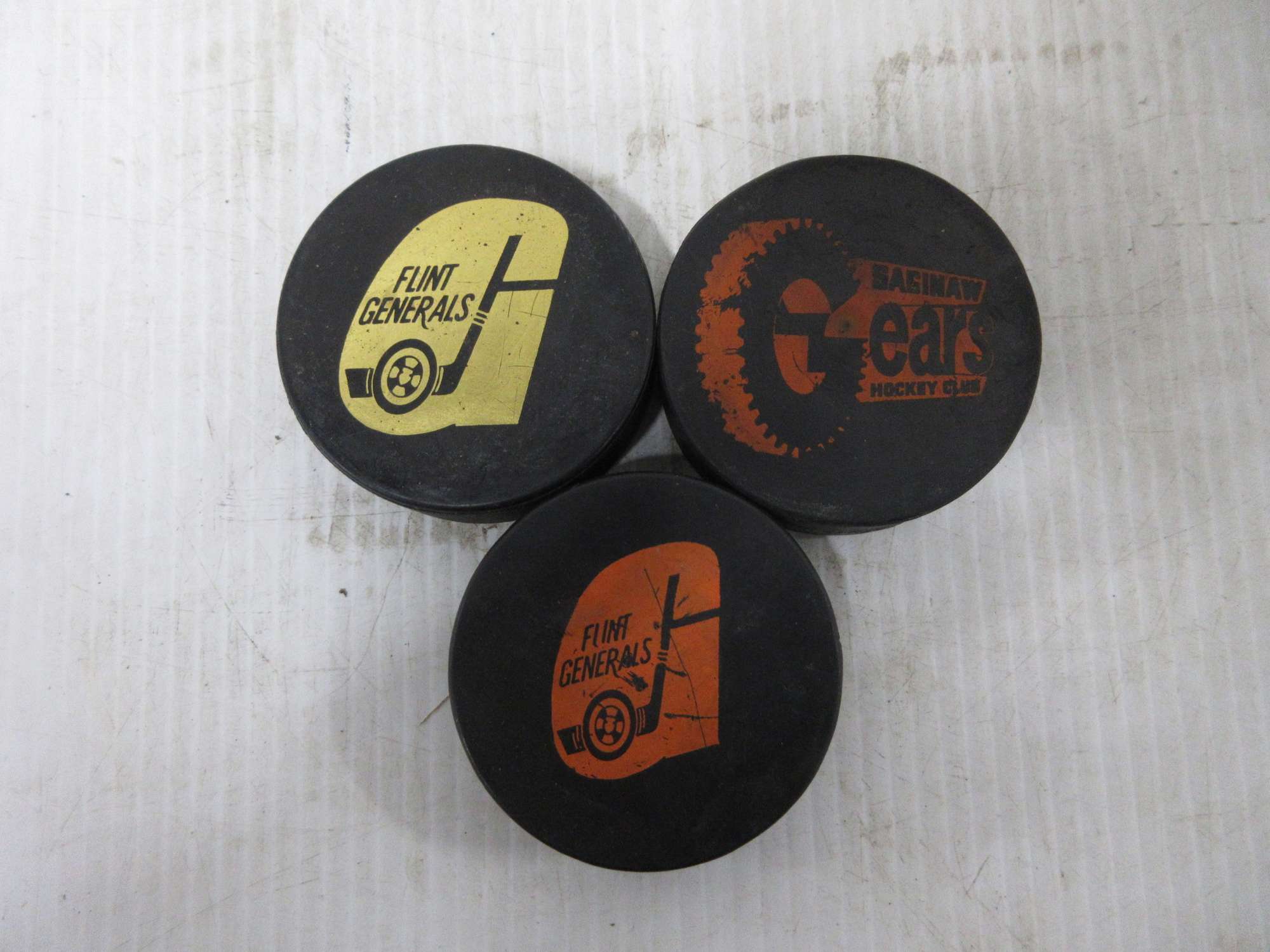 Albrecht Auctions | Flint Generals and Saginaw Gears Vintage Hockey Pucks
