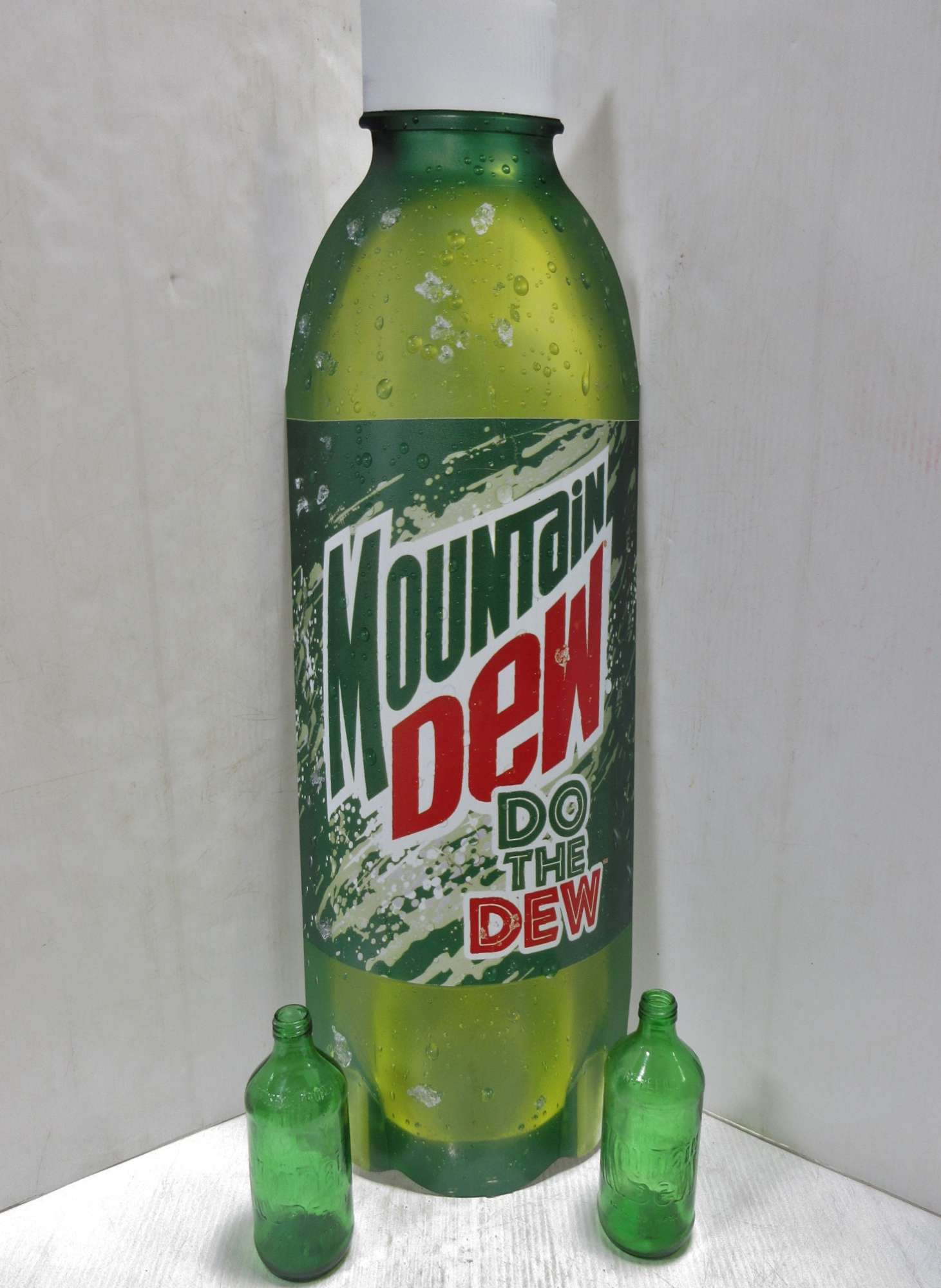 Albrecht Auctions | Tin Mountain Dew Curved Hanging Sign, 36"H; (2) 16 ...