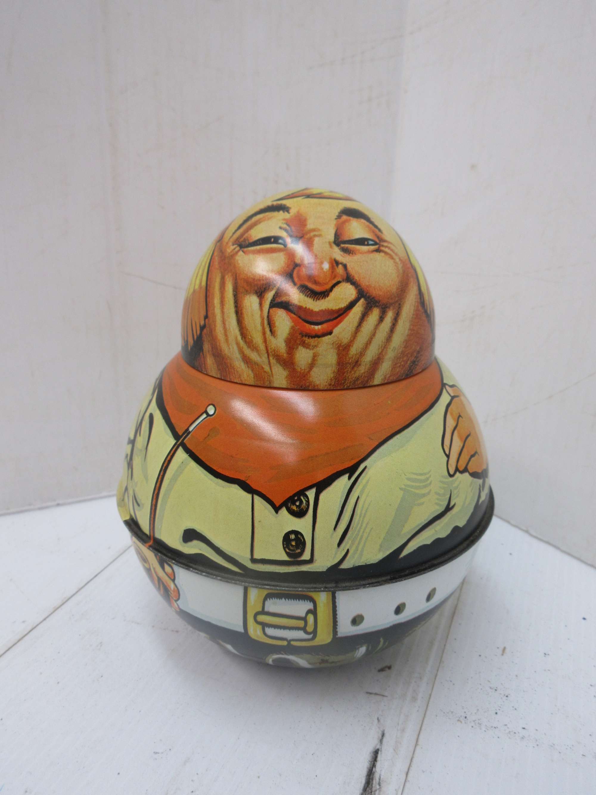 Albrecht Auctions | 1979 Tin Cowboy Roly-Poly Tobacco Container